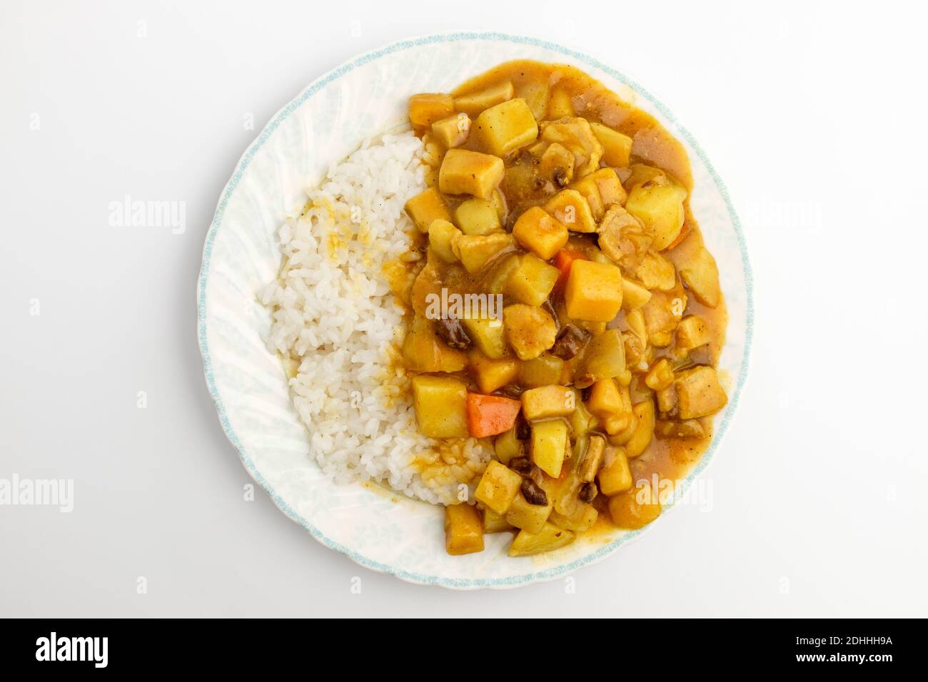 Curry and rice on white background Stock Photo - Alamy