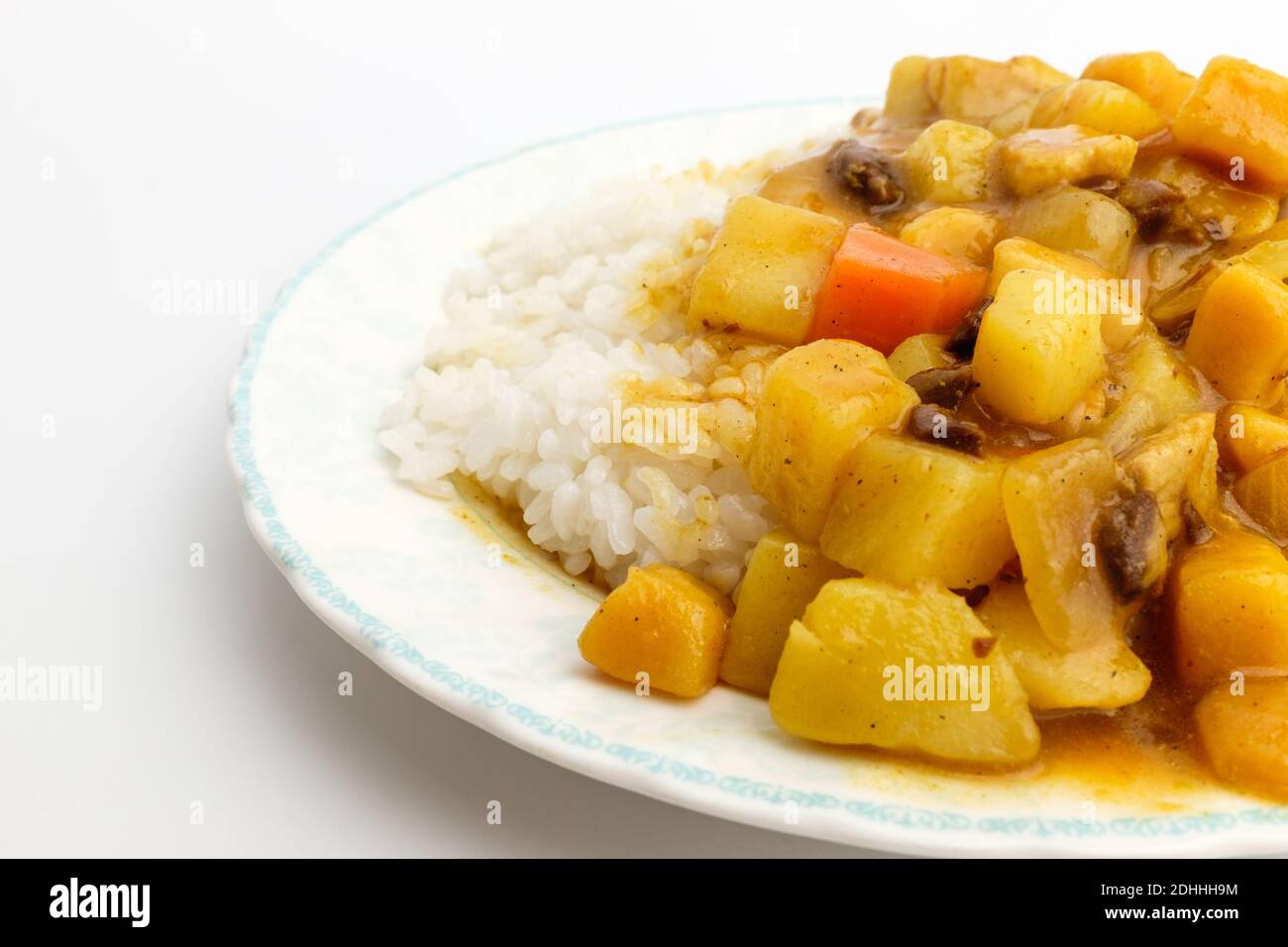 Curry and rice on white background Stock Photo - Alamy