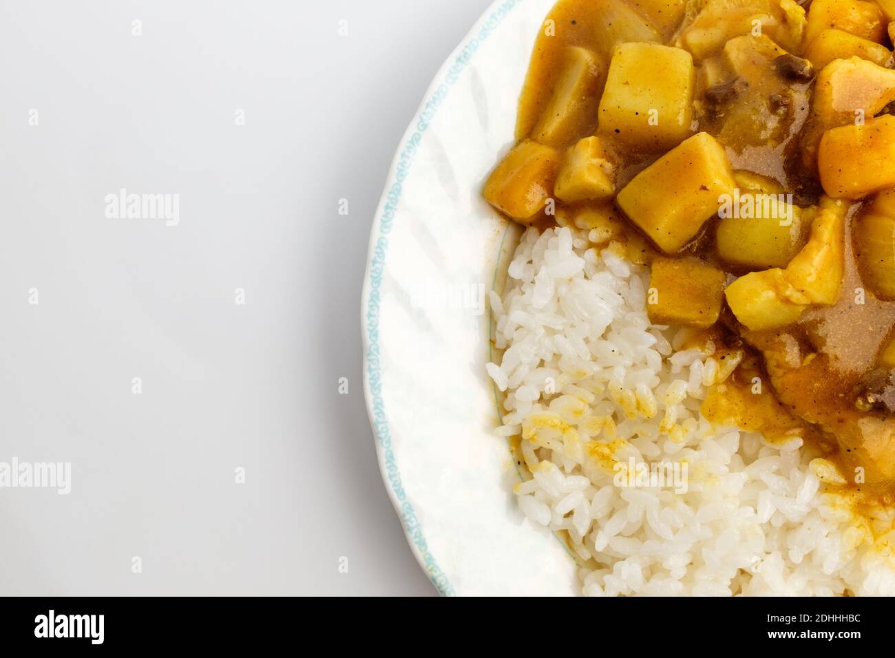 Curry and rice on white background Stock Photo - Alamy