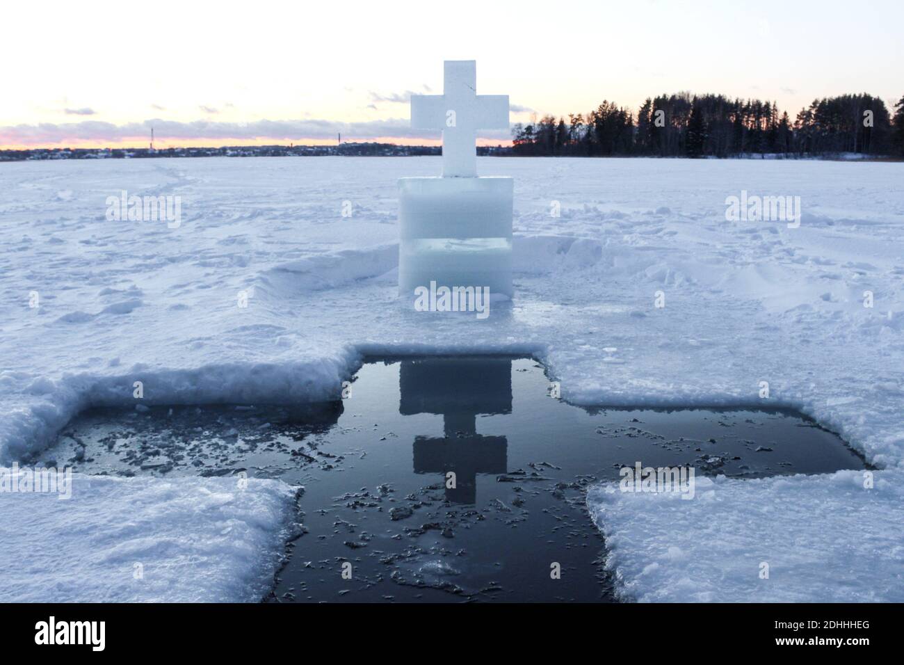 Holidays of Orthodox baptism. Ice cross hole and a cross of the feast ...