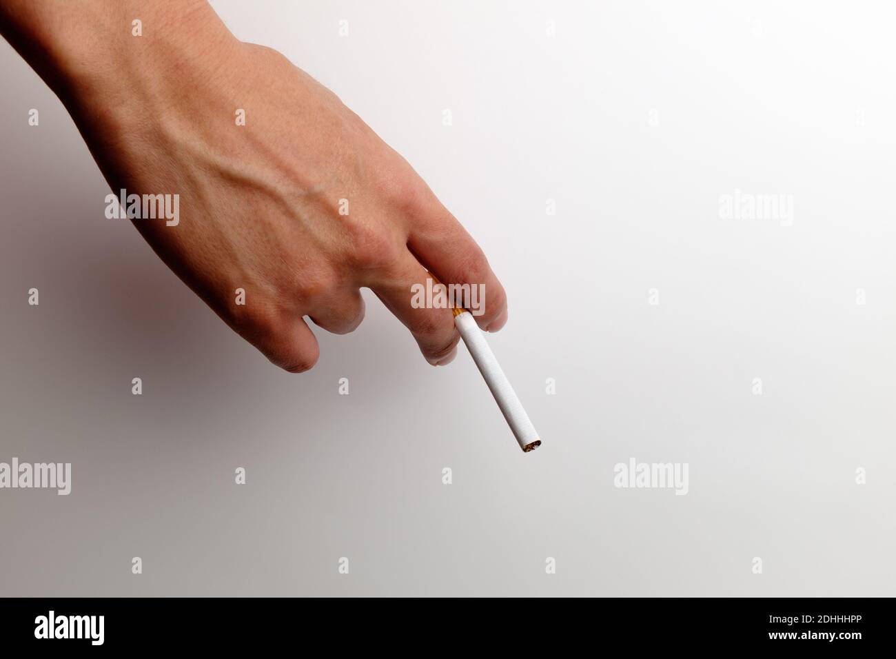 Short cigarette on white background Stock Photo - Alamy