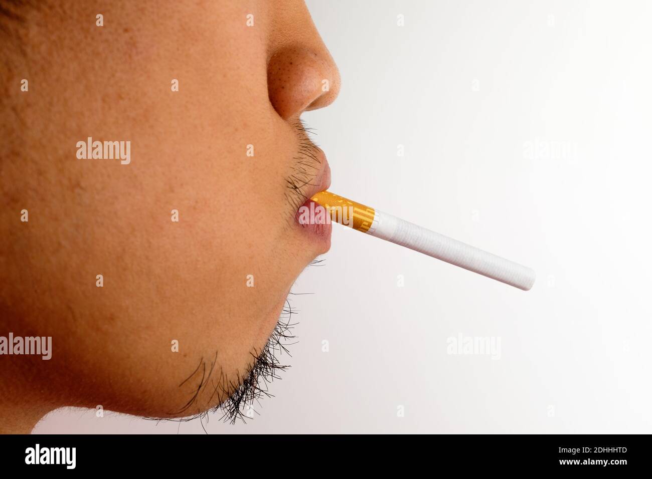 Short cigarette on white background Stock Photo - Alamy