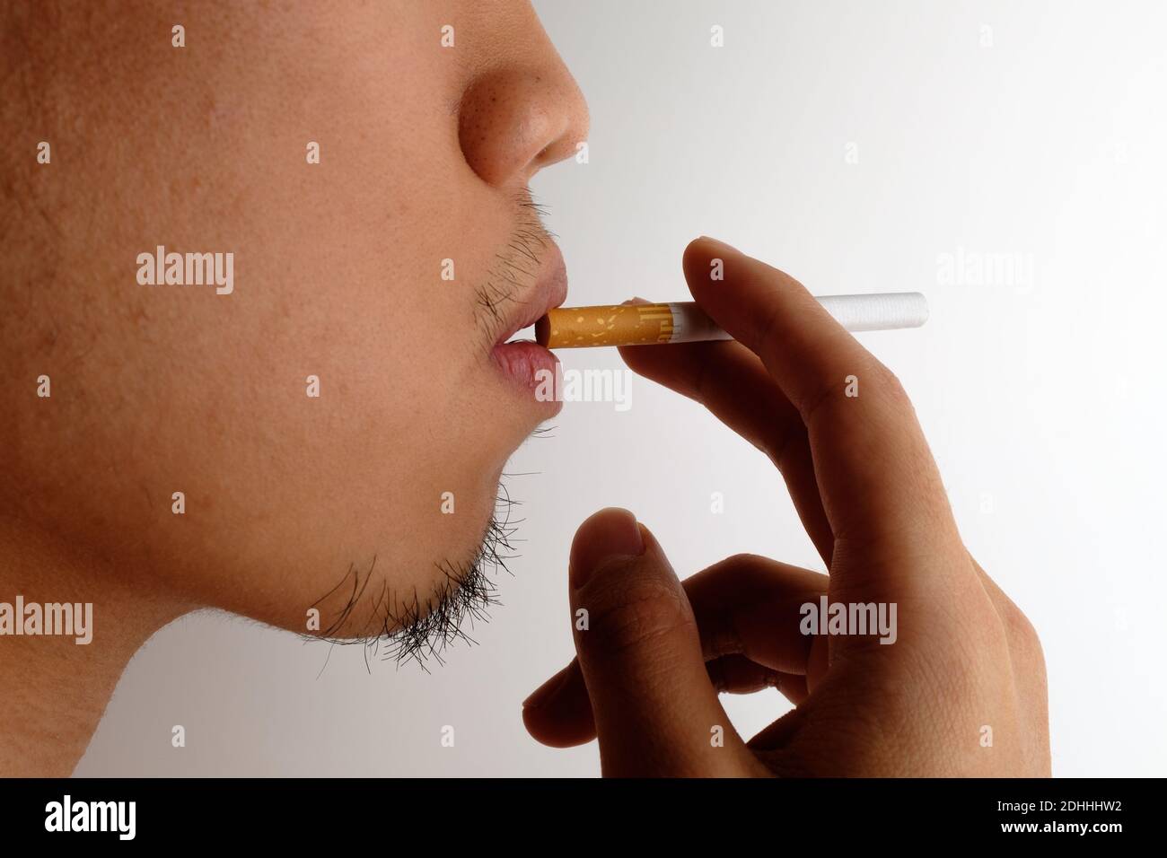 Short cigarette on white background Stock Photo - Alamy