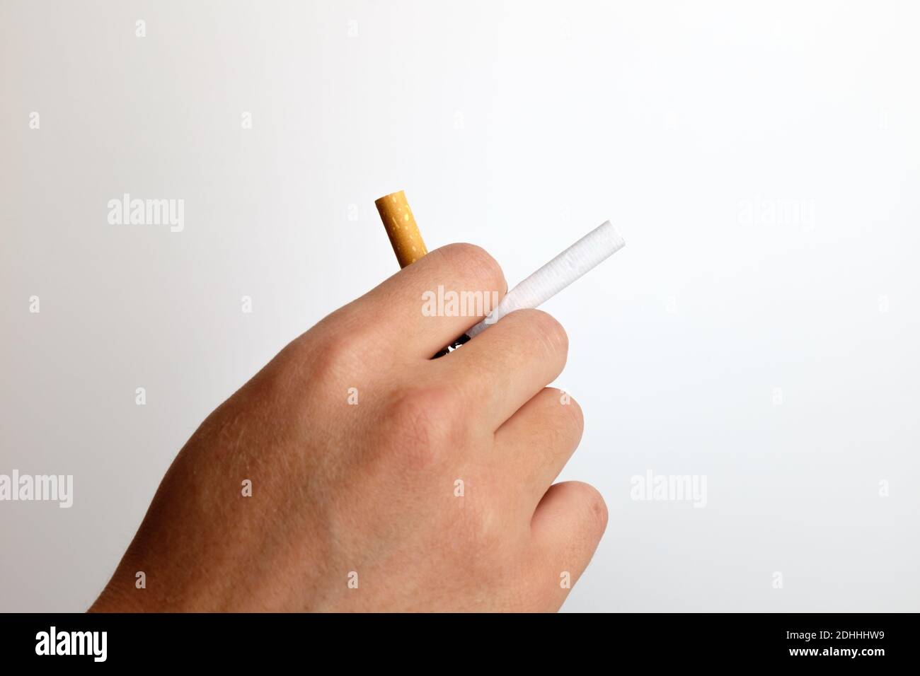Short cigarette on white background Stock Photo - Alamy