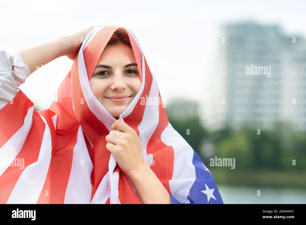 Portrait Of Young Happy Refugee Woman With Usa National Flag On Her