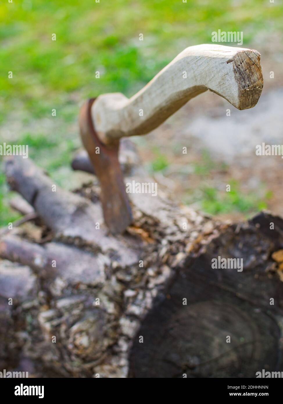 Axe on the beam in village yard Stock Photo - Alamy