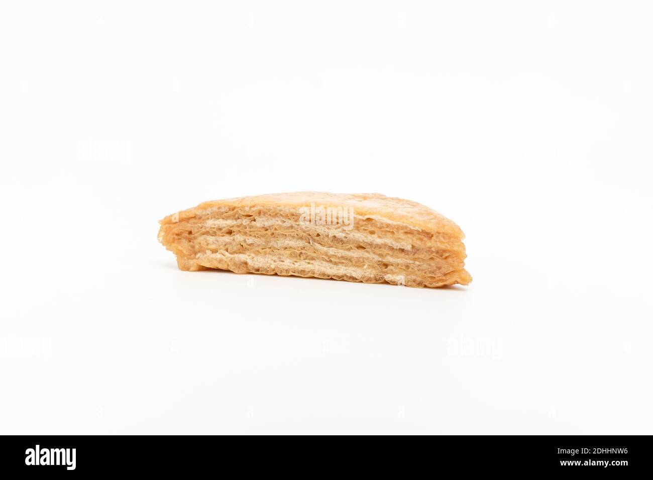 Triangle fried tofu on white background Stock Photo - Alamy