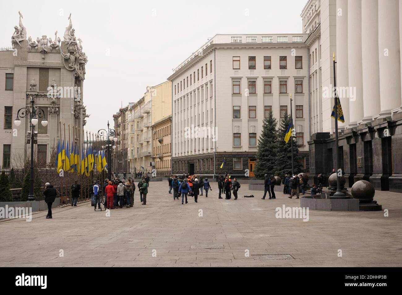 Journalists walking around the square in front of the main entrance to ...