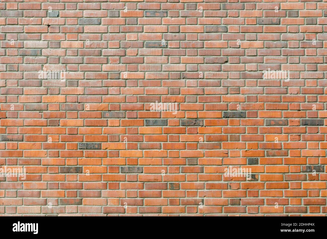 Wall of red bricks with cement layers Stock Photo - Alamy