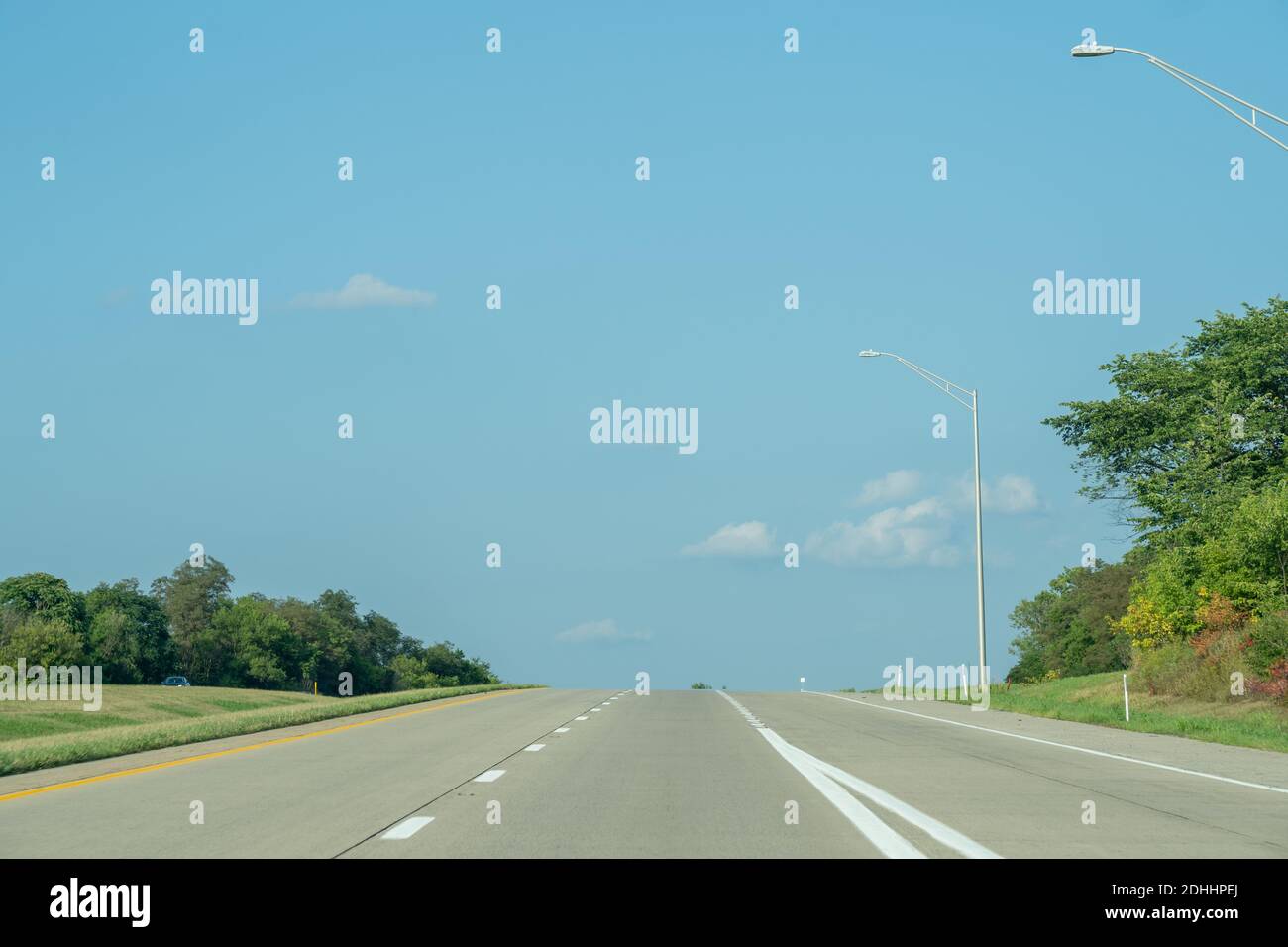 An empty interstate highway under a blue sky Stock Photo - Alamy