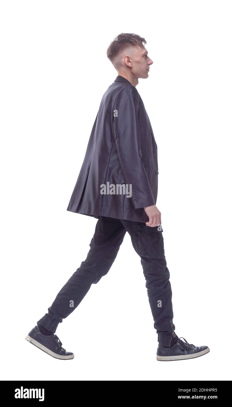 in full growth. confident young man striding forward Stock Photo - Alamy