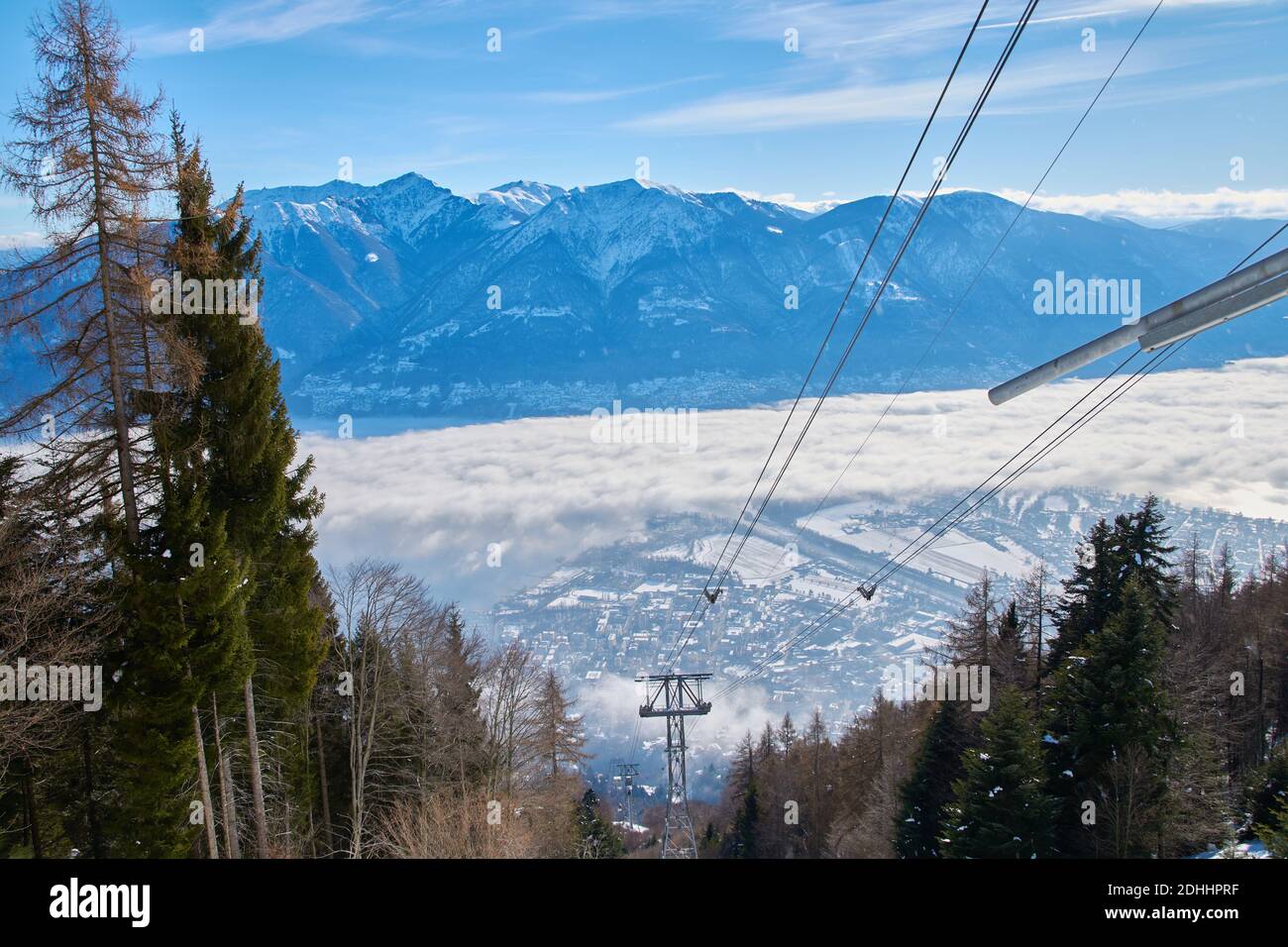 A beautiful shot of a zip line from the top to the bottom in winter ...