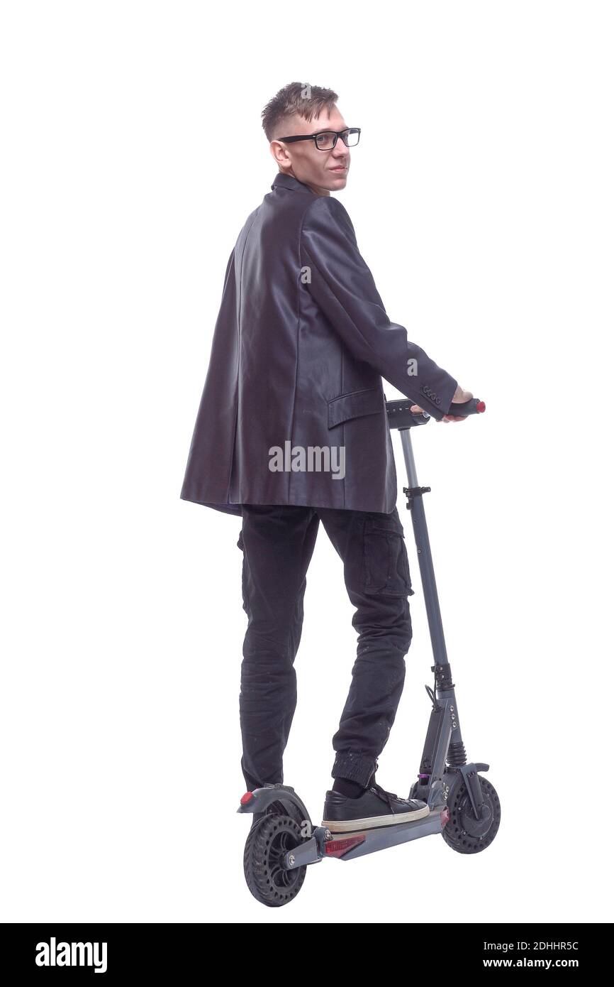 rear view. guy in glasses with an electric scooter looking at a white ...