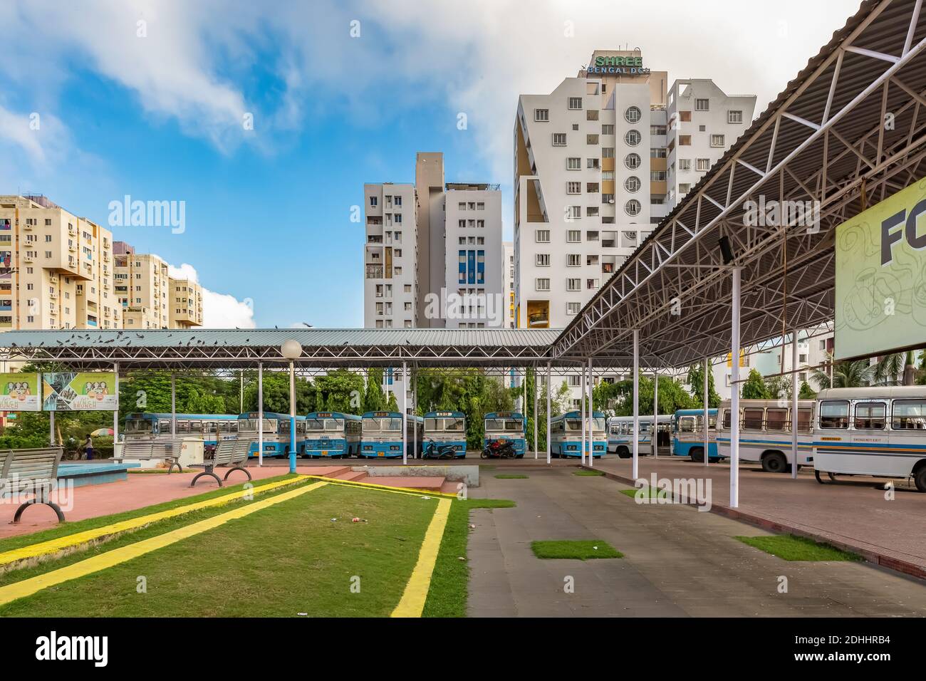 Public transport bus depot with city residential buildings at New Town ...