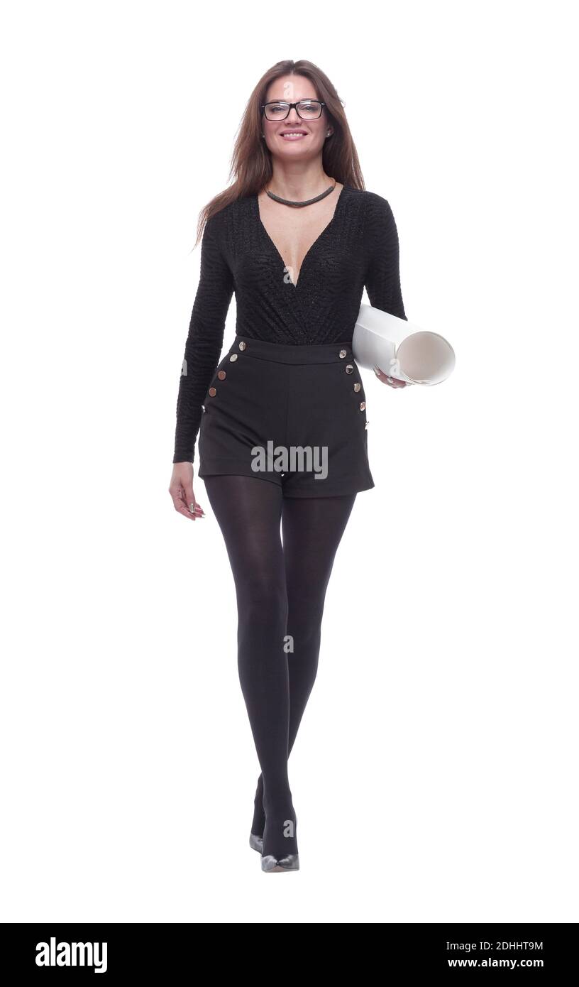 confident young woman with a roll of drawings striding forward Stock ...