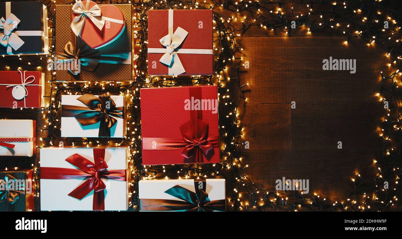 Colorful Christmas gifts, blinking lights and copy space, celebrations ...