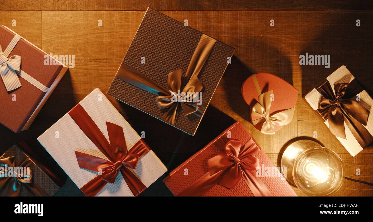 Beautiful Christmas gifts on a wooden table, holidays and celebrations ...