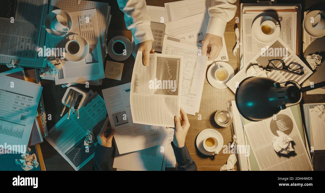 Business people working late at night in the office, deadlines and ...