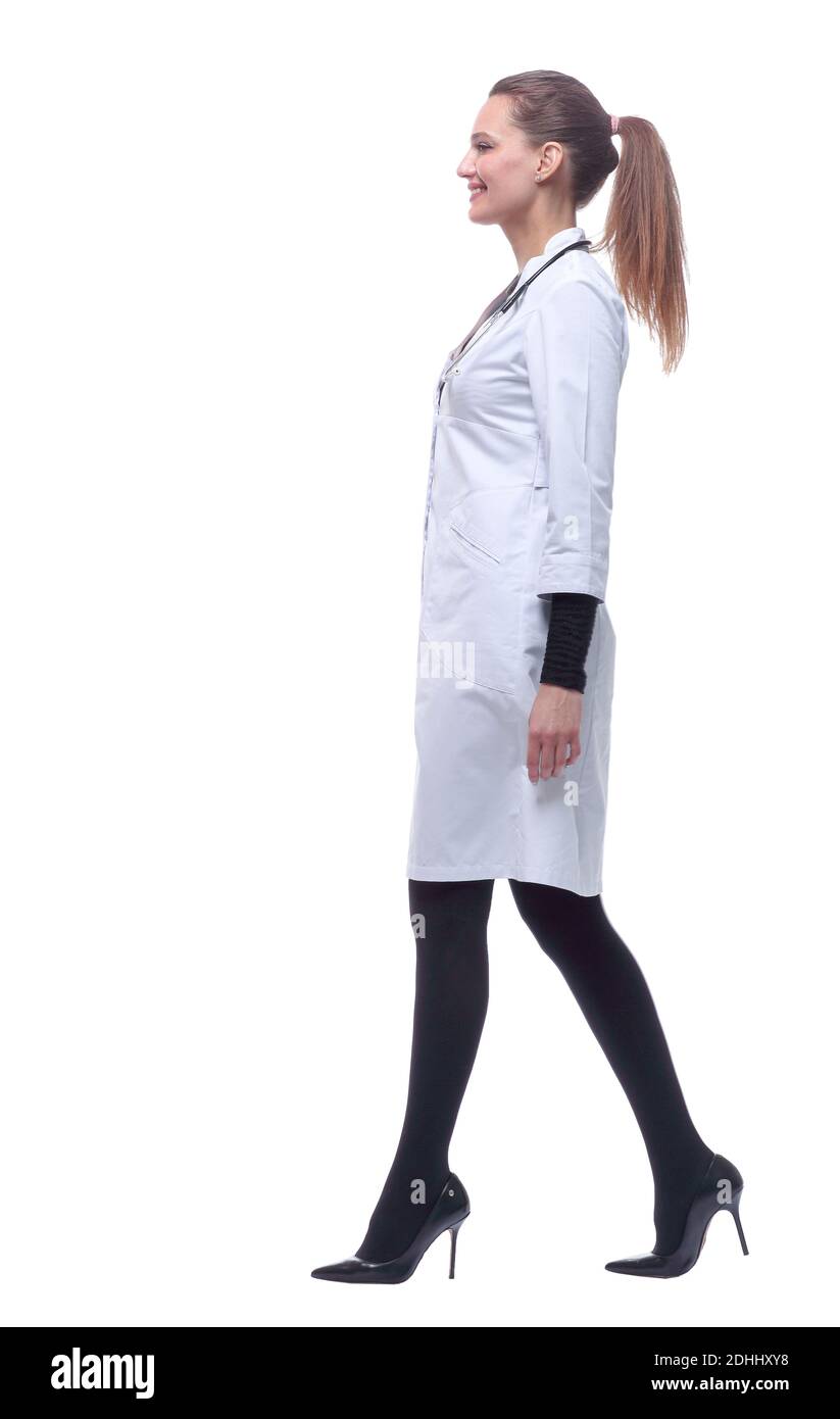 side view. smiling female paramedic striding forward Stock Photo - Alamy