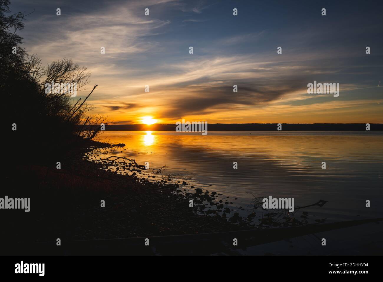 The reflection of sky on the water during sunset Stock Photo - Alamy