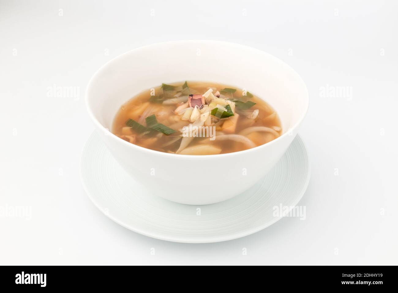 Squid soup on white background Stock Photo - Alamy