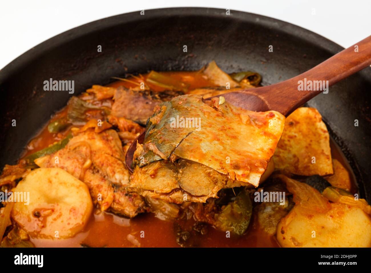 Stew with fish and vegetables. Spicy fish stew. Fish seasoned dish ...