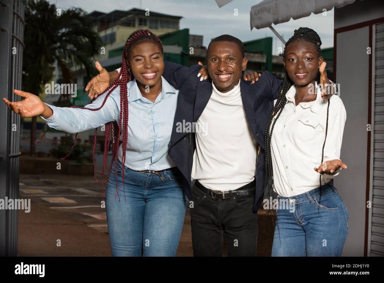 group of young people standing watching the camera smiling Stock Photo ...