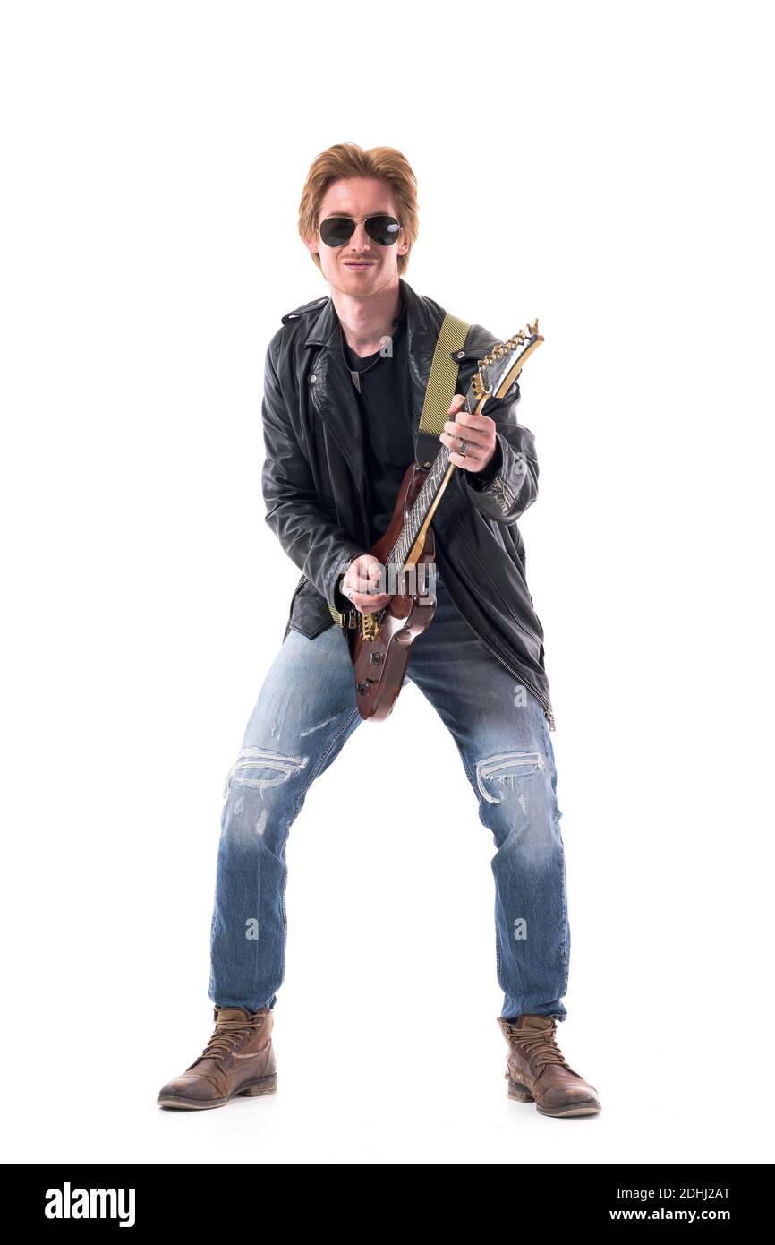 Cool smiling confident young guitarist playing rock music on electric ...