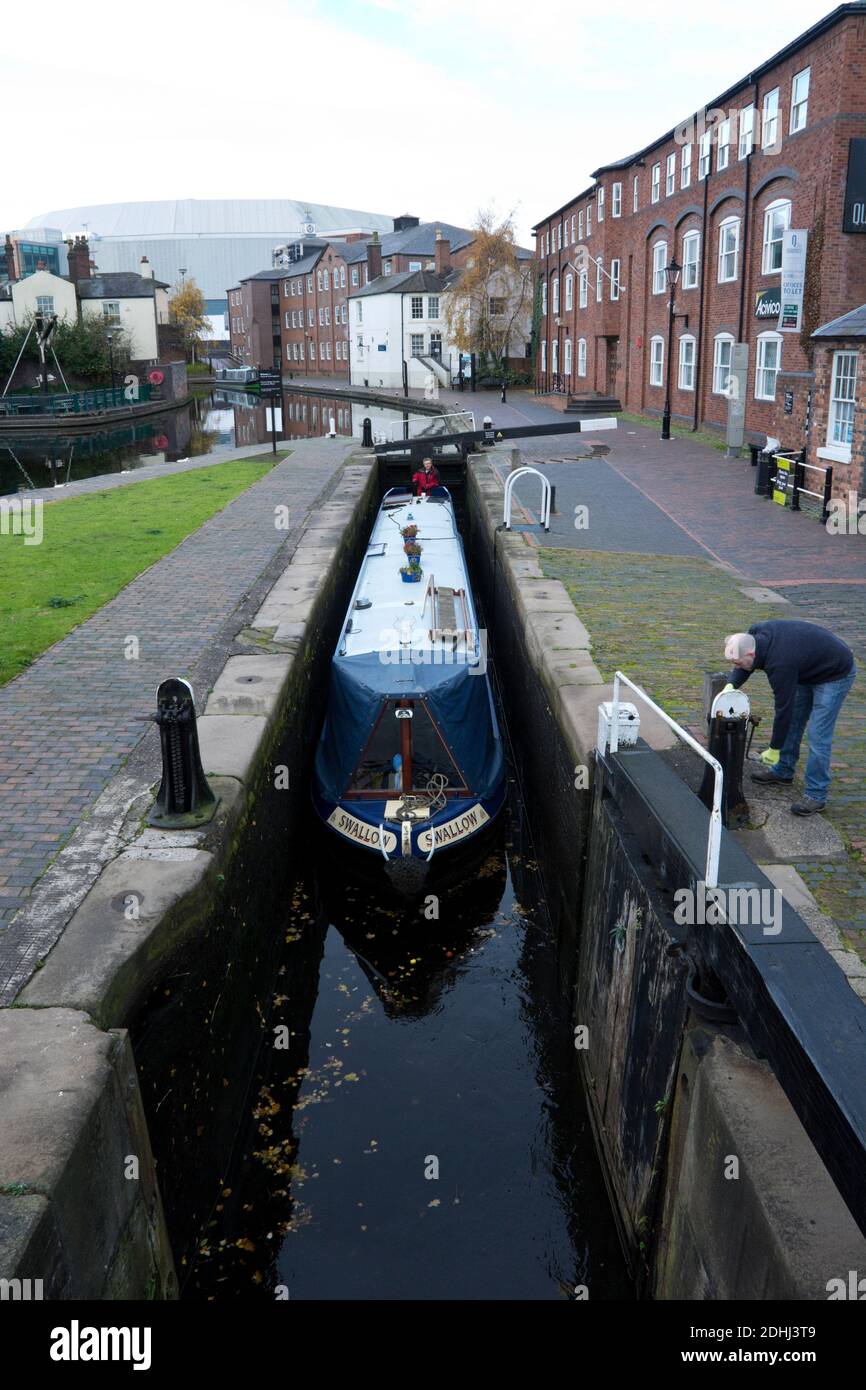 A Narrowboat Negotiates A Canal Lock Near Brindley Place In Birmingham ...