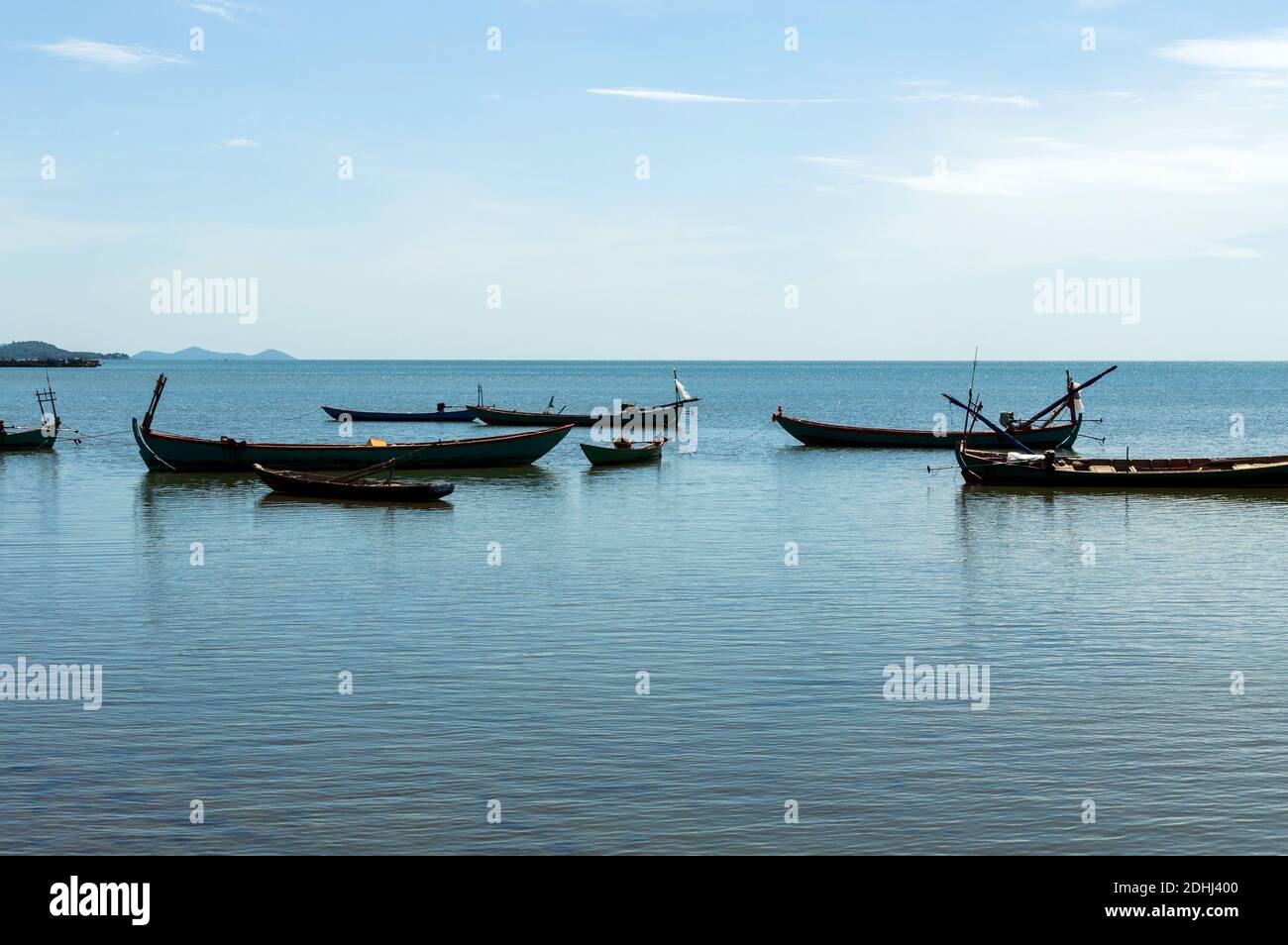 Two small fishing boat floating on the water Stock Photo - Alamy