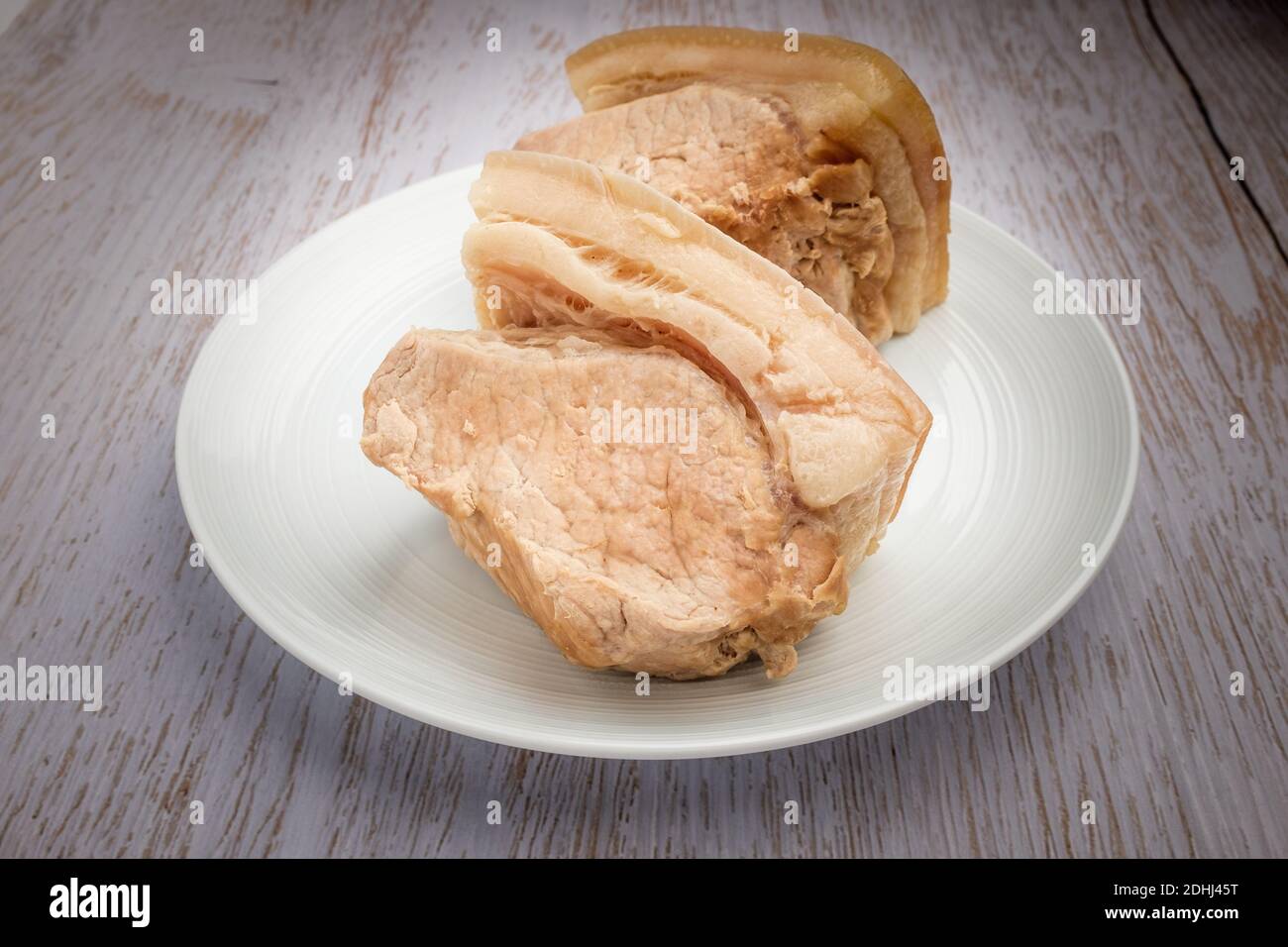 Boiled pork on white background Stock Photo - Alamy