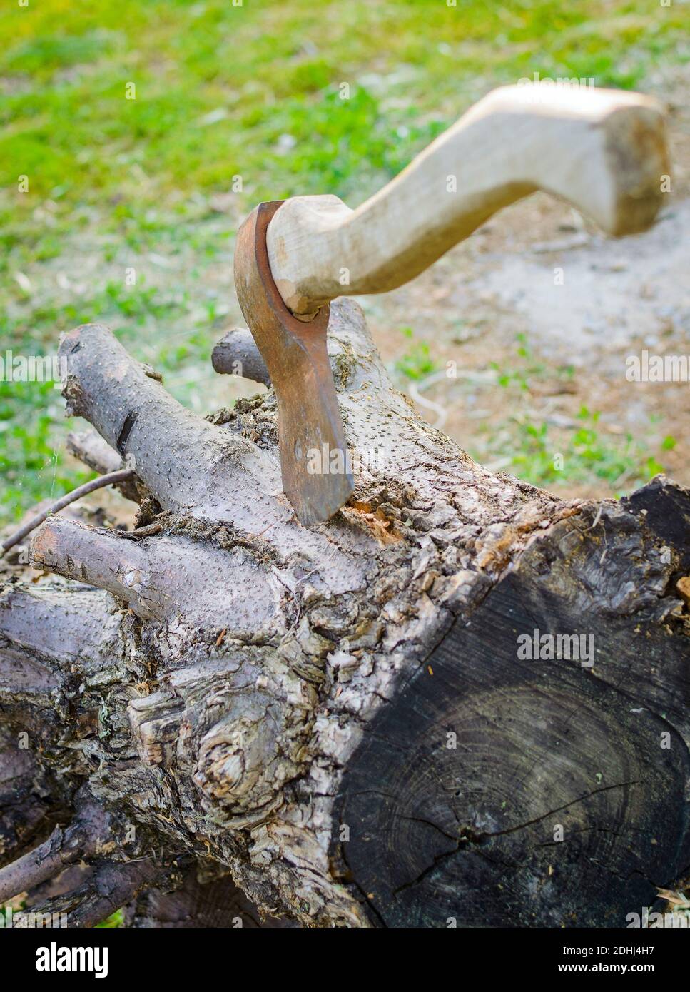 Axe on the beam in village yard Stock Photo - Alamy
