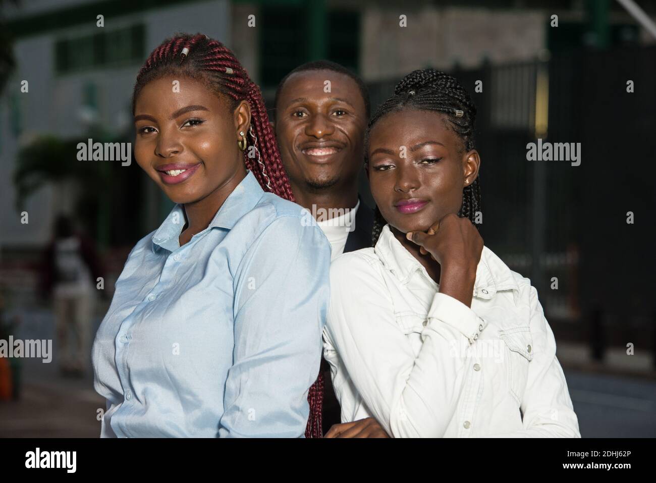 group of young people standing watching the camera smiling Stock Photo ...