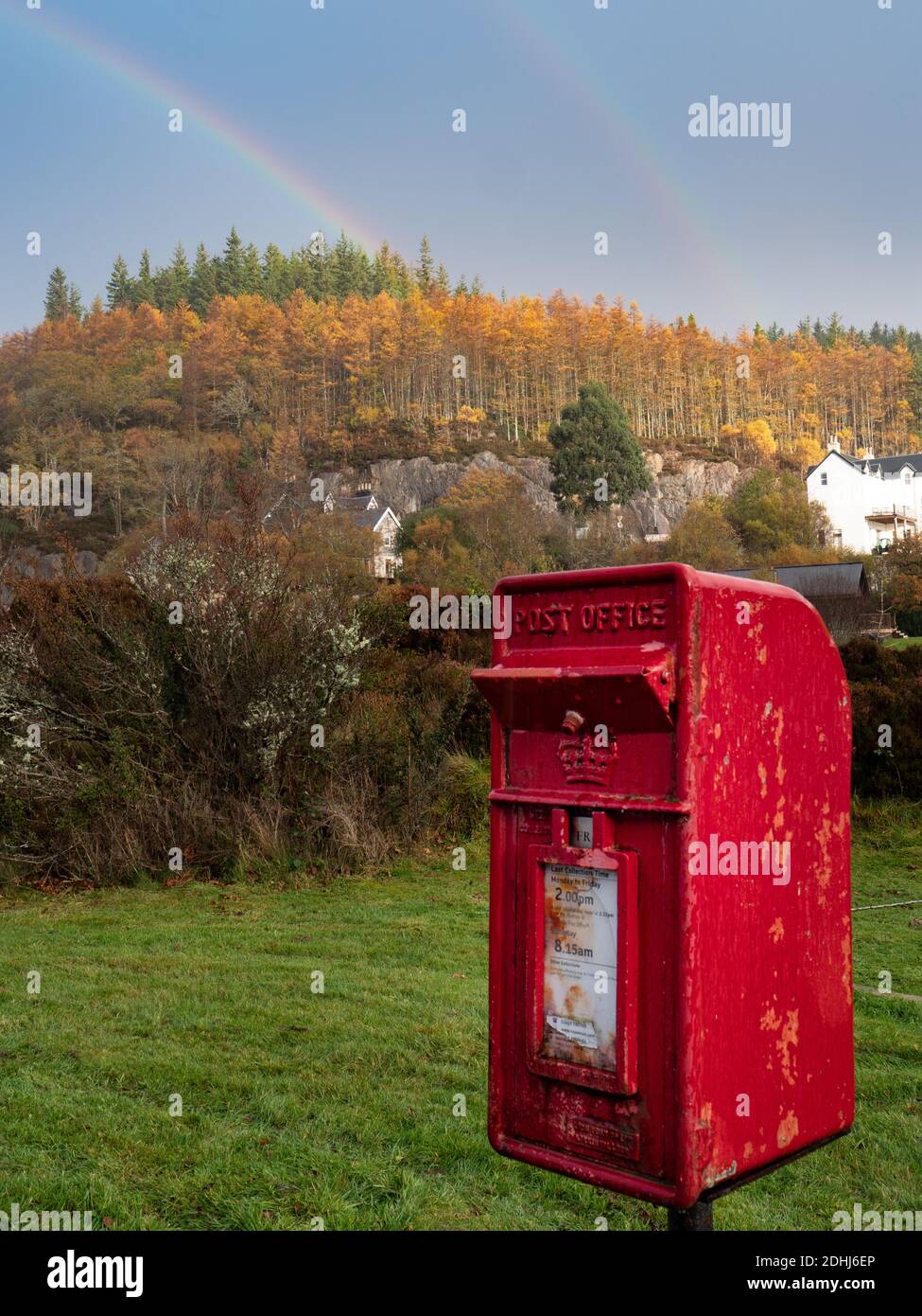 Red posting box with a double rainbow in the background Scotland UK ...