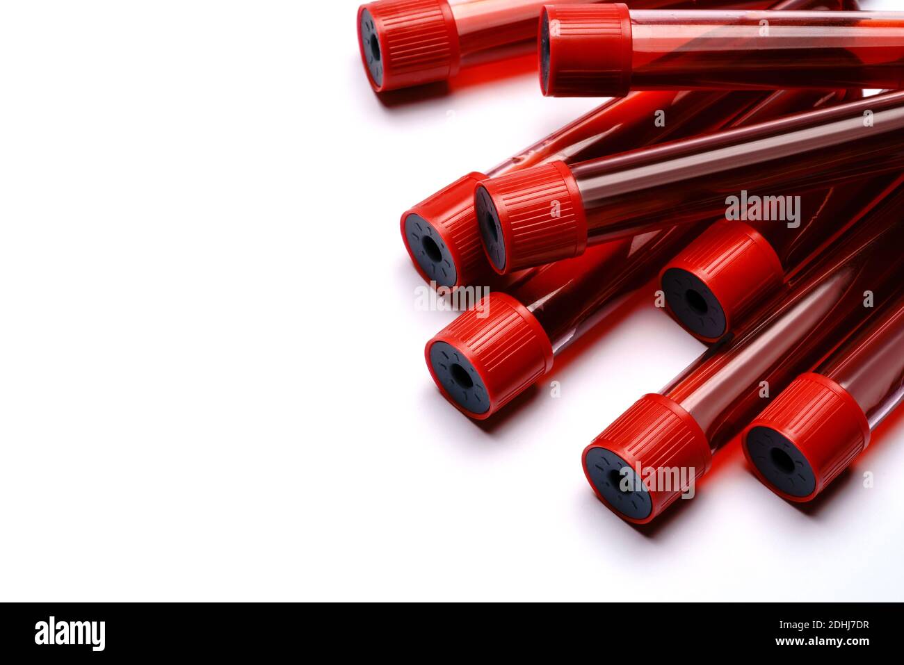 Test tubes with red plug isolated on white background Stock Photo - Alamy