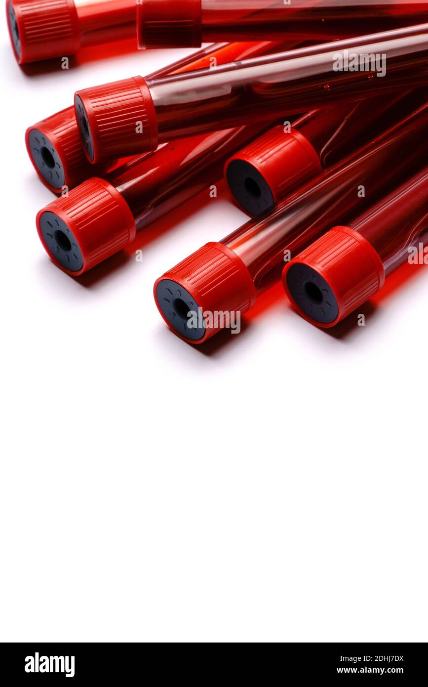 Test tubes with red plug isolated on white background Stock Photo - Alamy