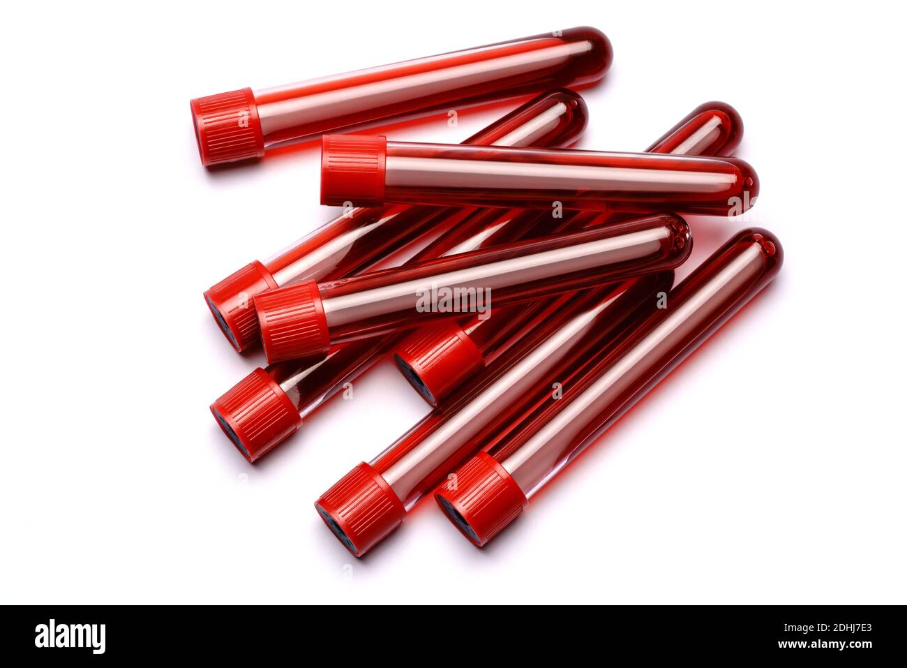 Test tubes with red plug isolated on white background Stock Photo - Alamy