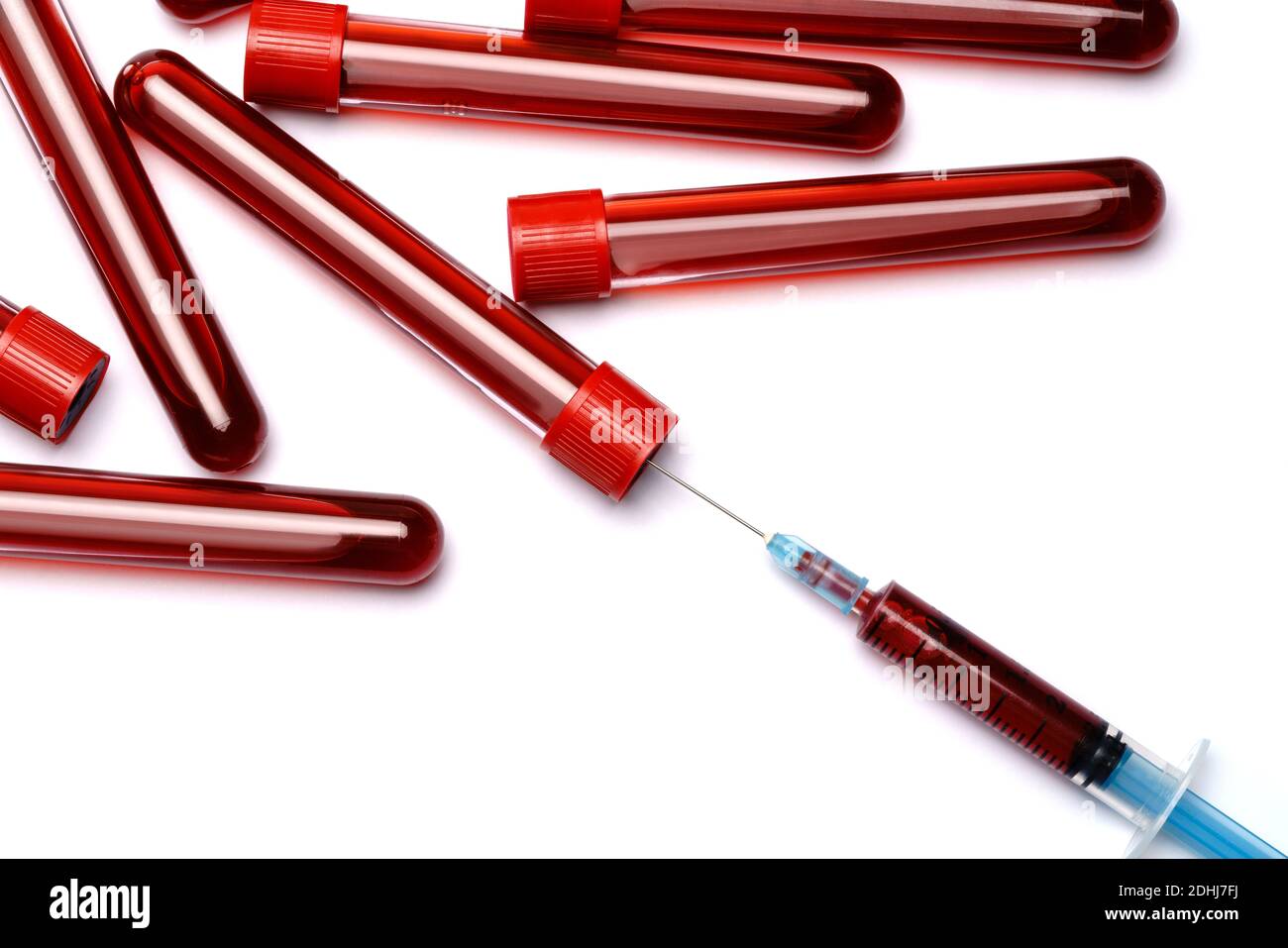 Medical syringe and plastic test tube isolated on white background ...