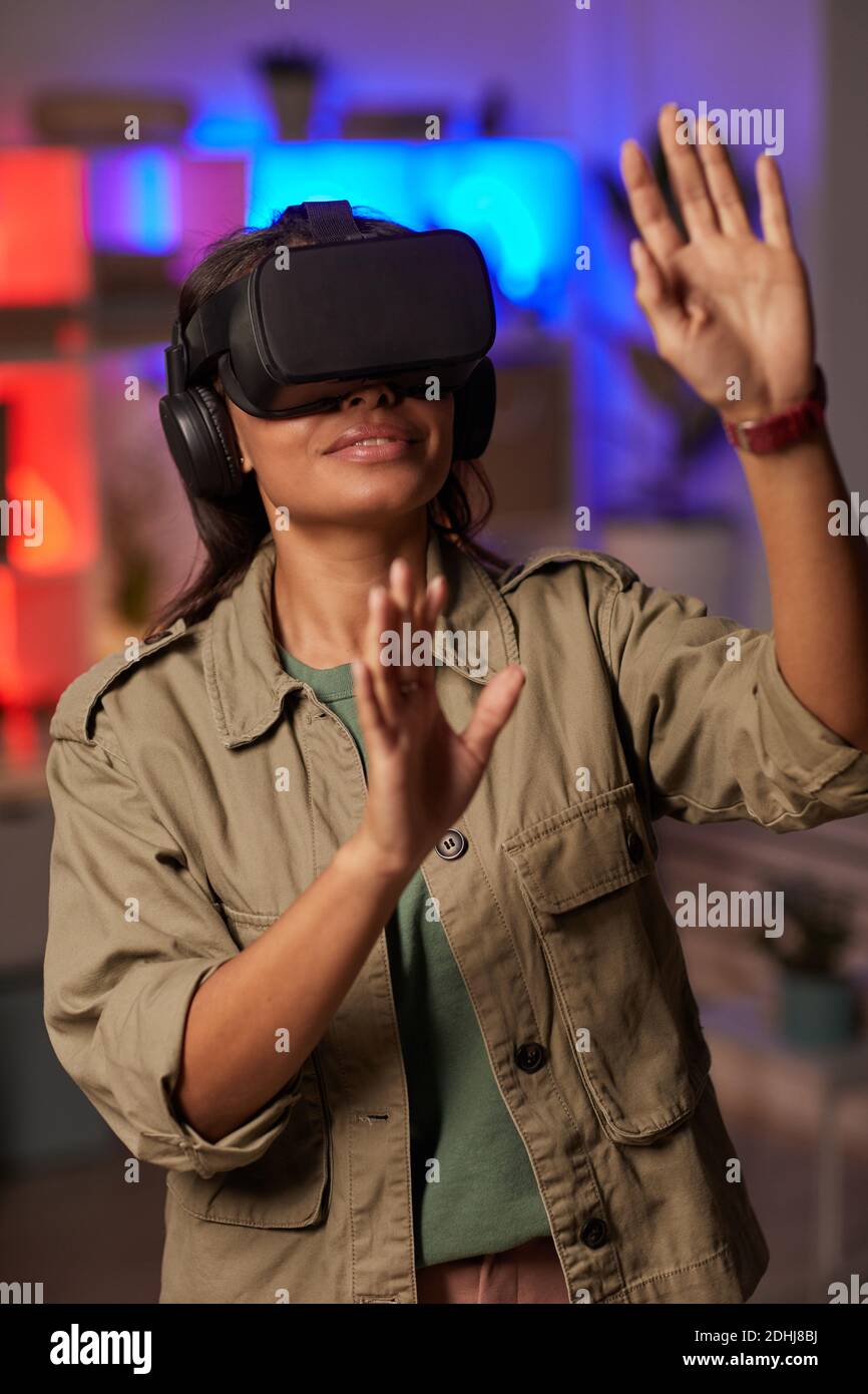 Woman playing video games standing hi-res stock photography and images ...
