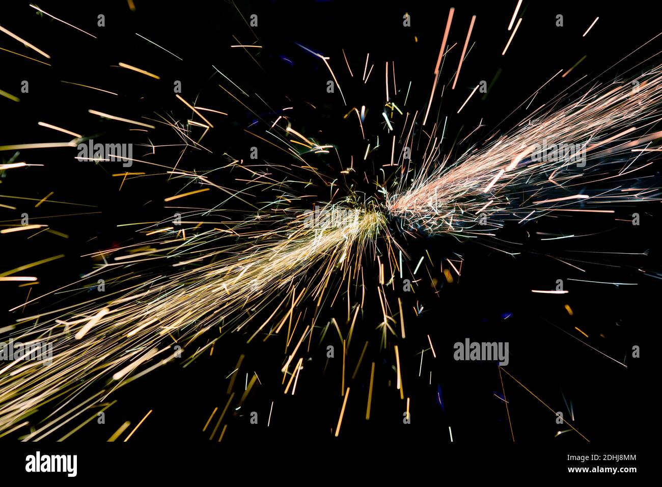 bright sparks of metal against dark background Stock Photo - Alamy
