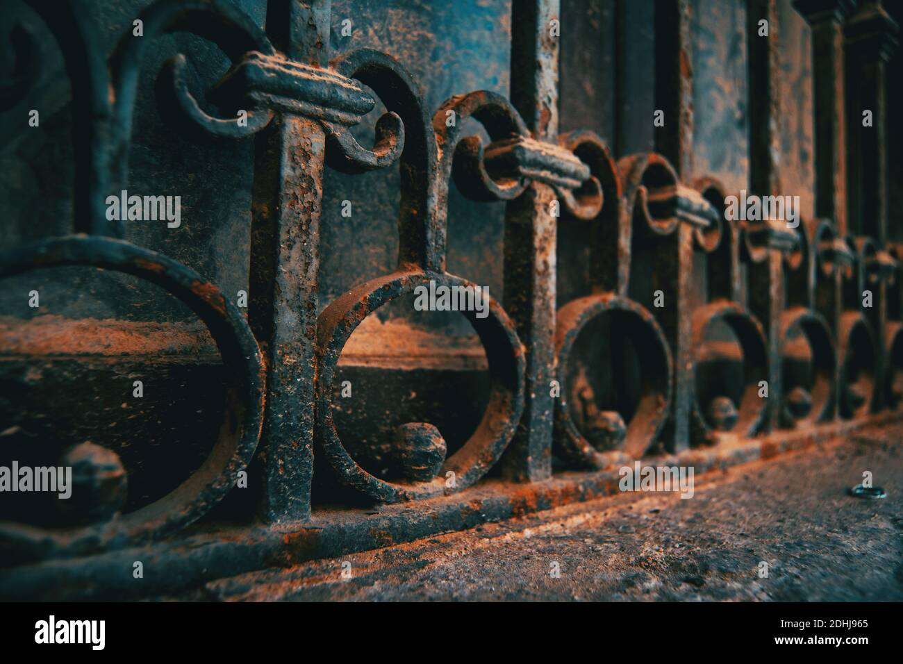 window with a rusty grille with a wrought iron pattern Stock Photo - Alamy