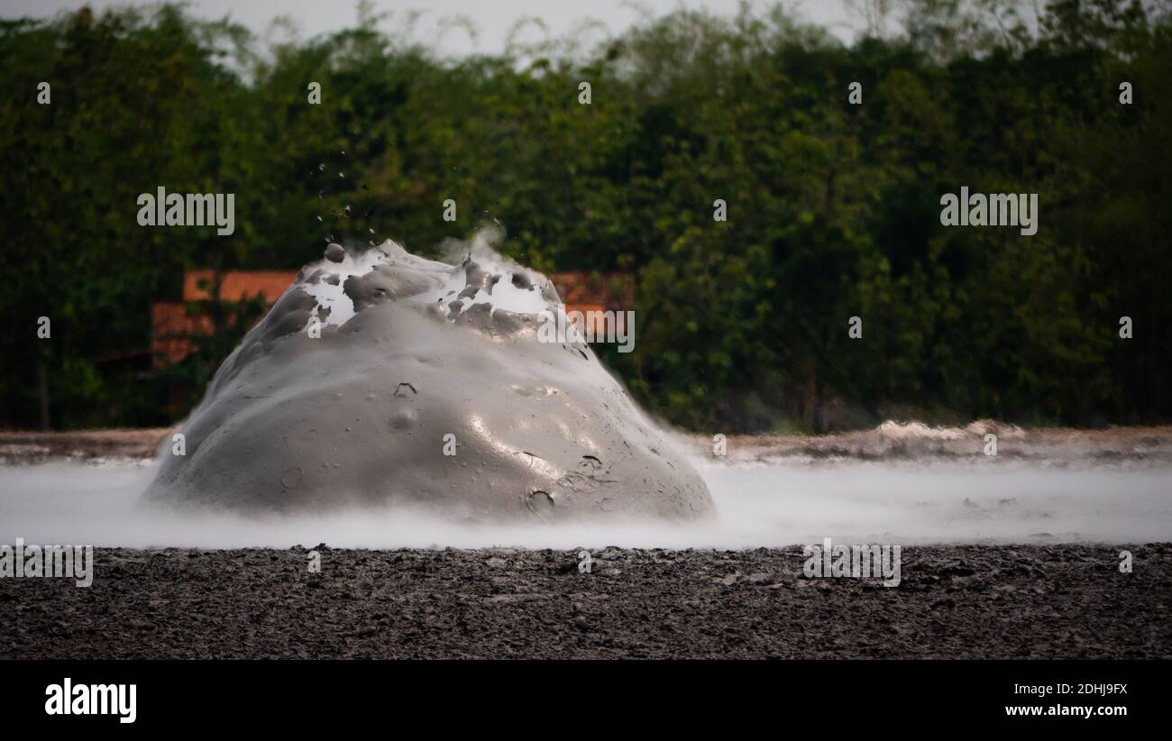 mud volcano with bursting bubble bledug kuwu. volcanic plateau with ...