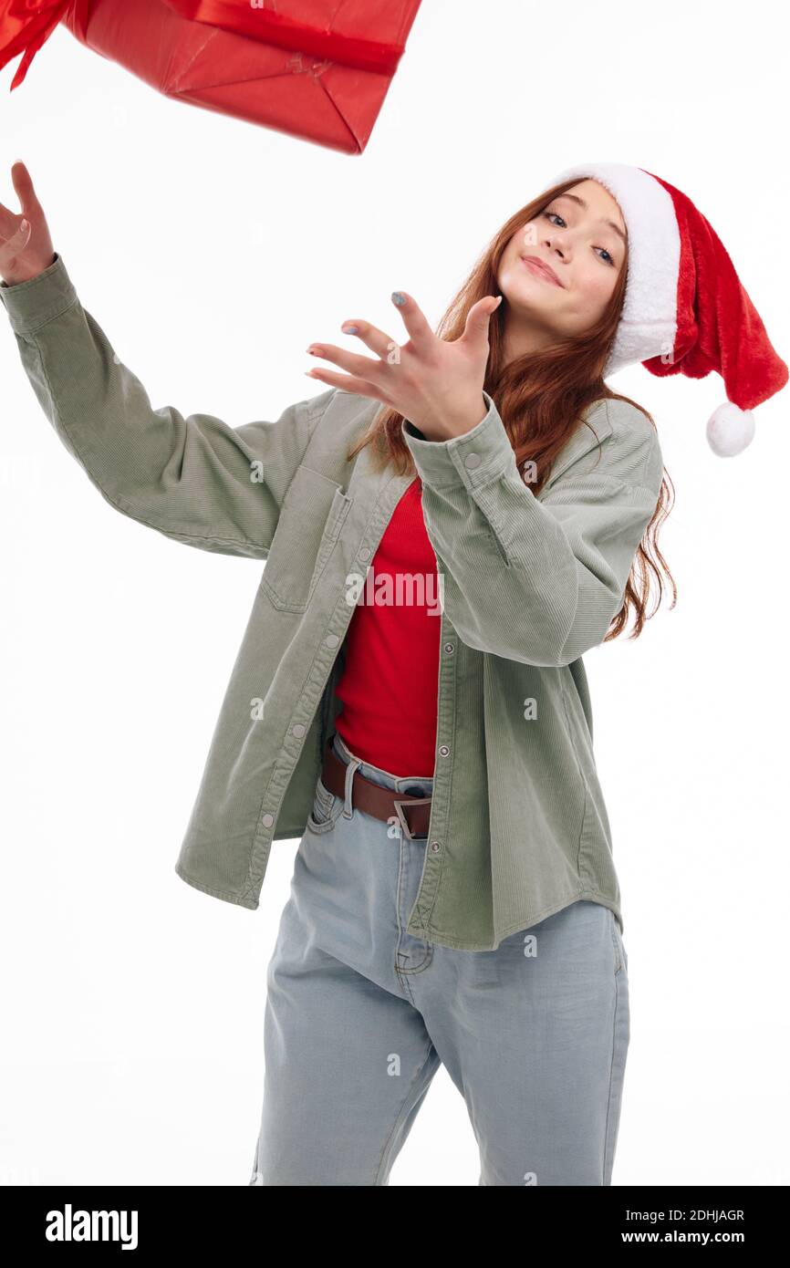 girl throws a box with a gift over her head New year holiday fun Stock ...