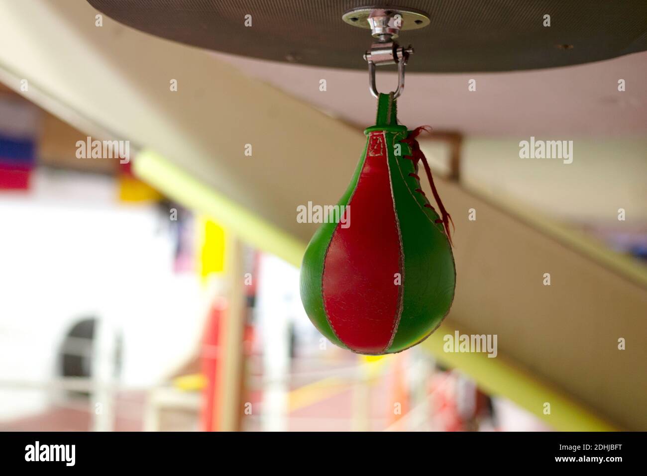 Green and red punching bag at a boxing gym Stock Photo - Alamy