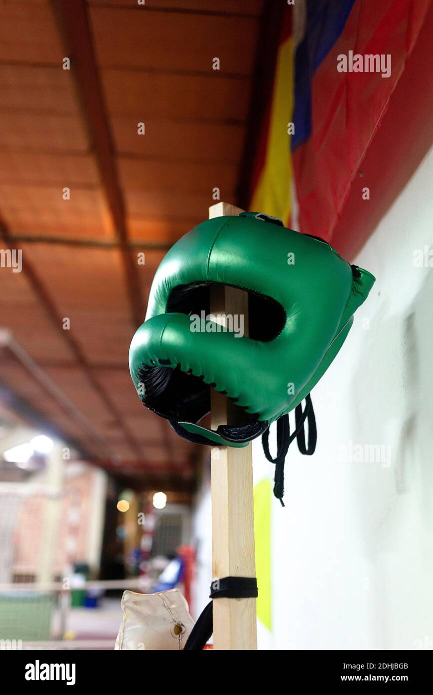 Image of a green boxing helmet in a boxing gym Stock Photo - Alamy