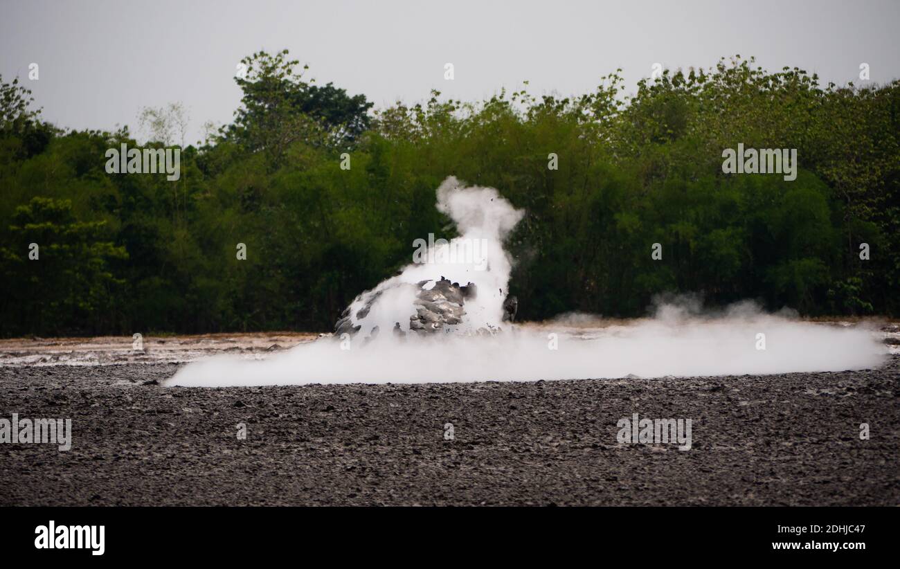 mud volcano with bursting bubble bledug kuwu. volcanic plateau with ...