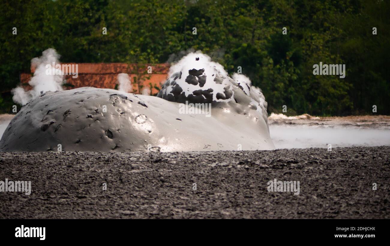 mud volcano with bursting bubble bledug kuwu. volcanic plateau with ...