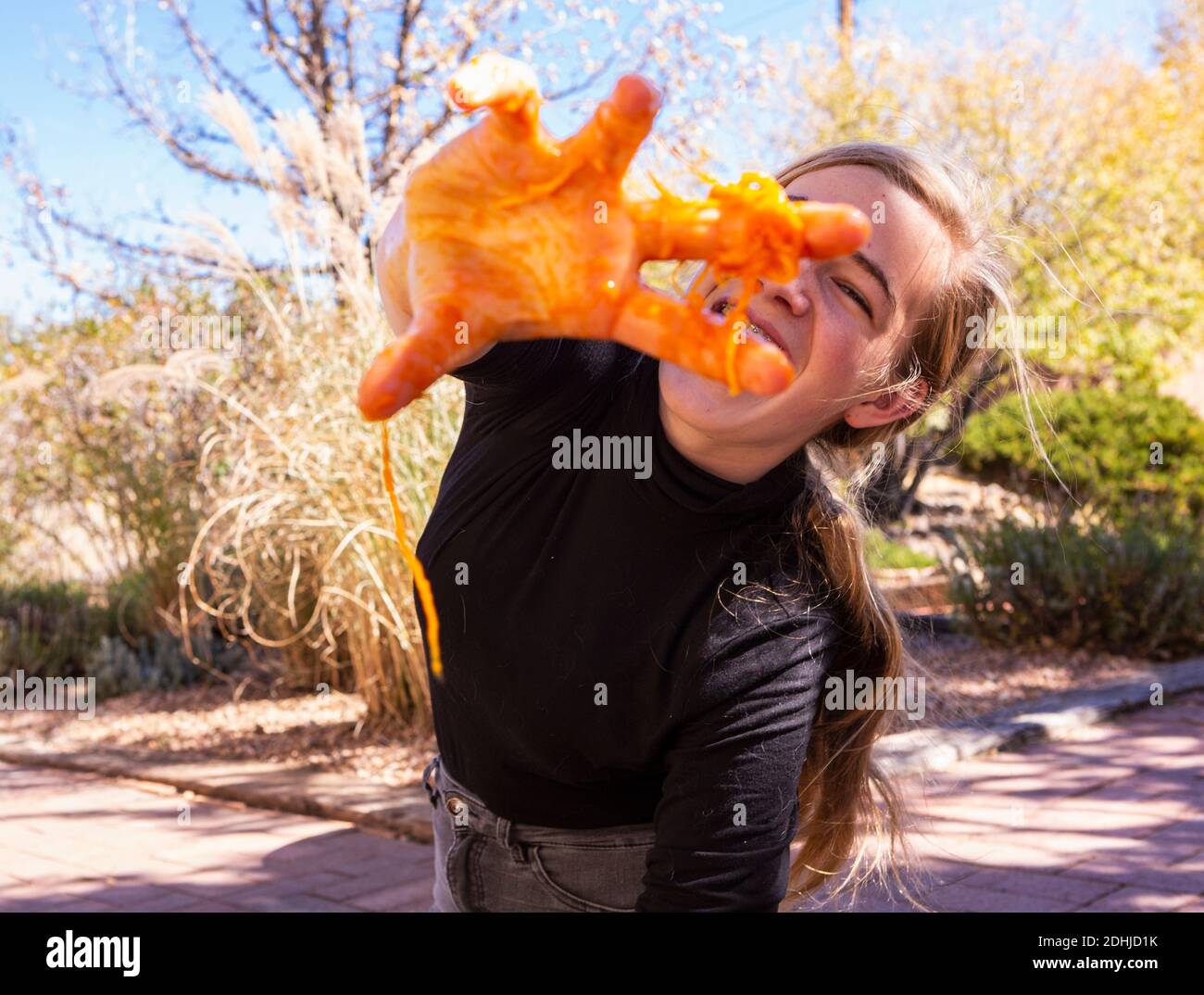 Teenage girl with pumpkin "goop" on her fingers Stock Photo - Alamy