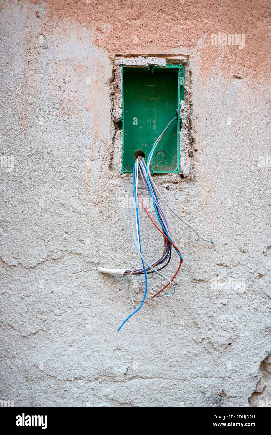 Electric cables hanging down during a renovation job Stock Photo - Alamy