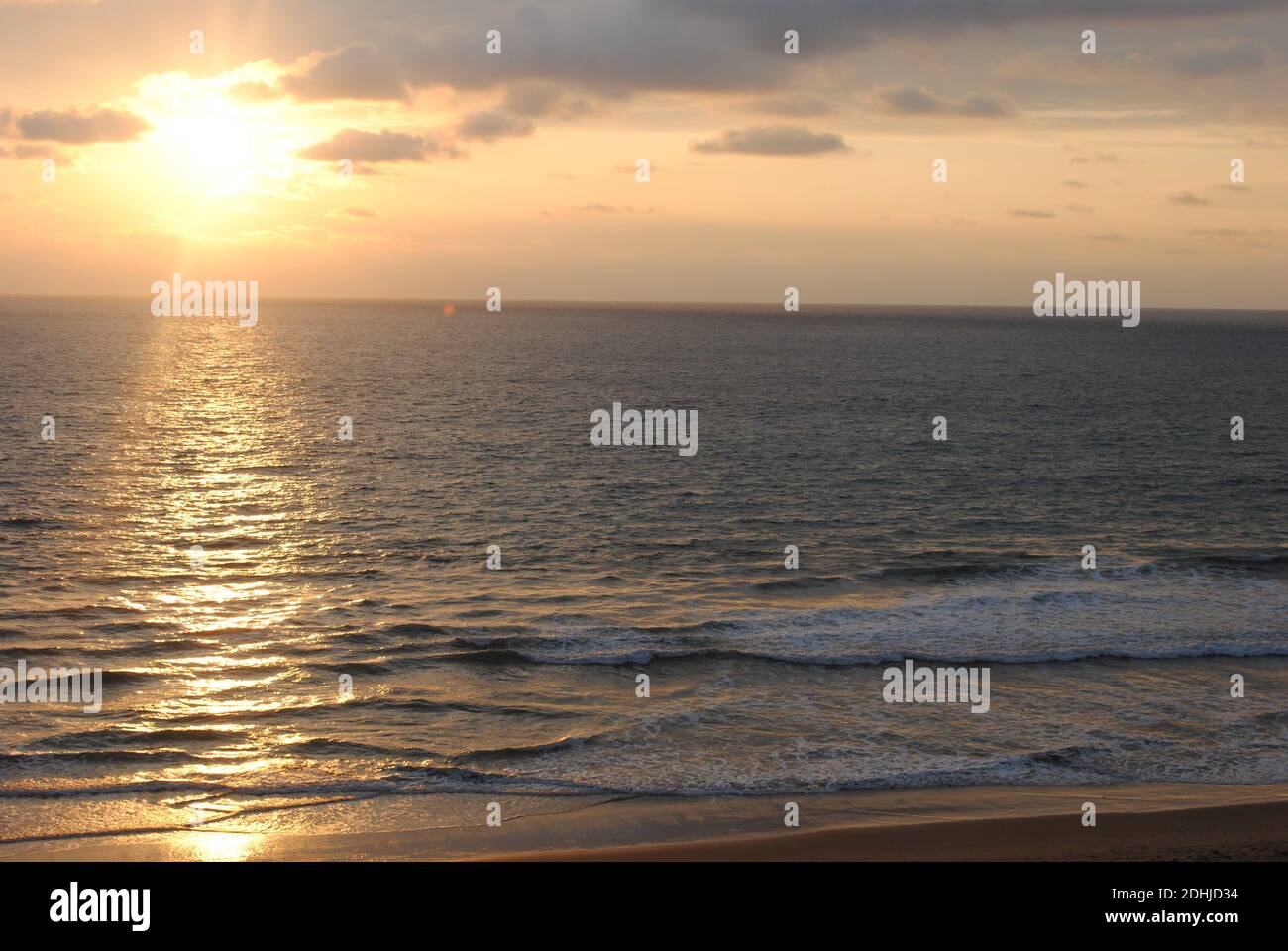 A breathtaking peaceful sunset captured at the beach Stock Photo - Alamy
